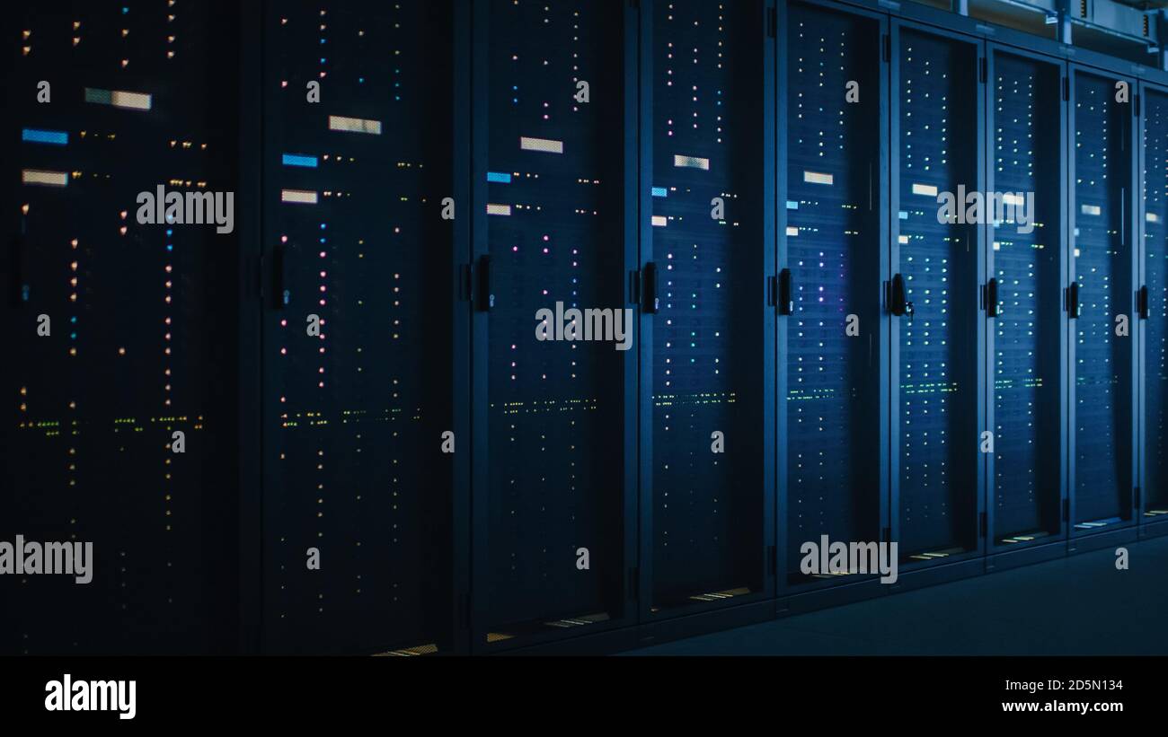 Shot of Dark Data Center With Multiple Rows of Fully Operational Server ...