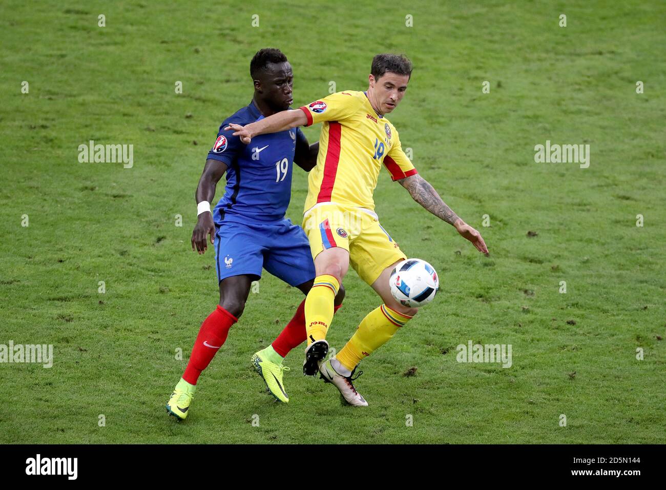 France's Bacary Sagna (left) and Romania's Bogdan Stancu battle for the ...