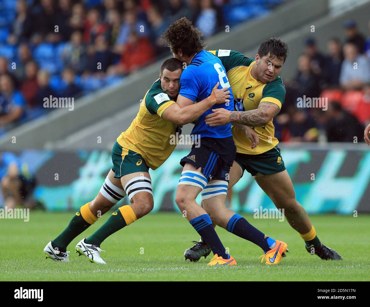 Australia's Isack Rodda (left) and Tyrel Lomax (right) tackle Italy's ...