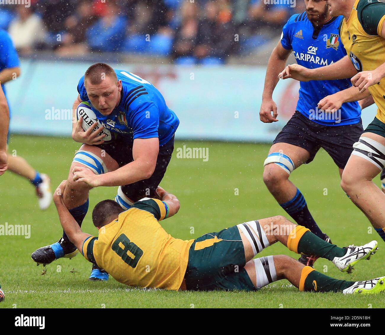 Australia's Maclean Jones (8) tackles Italy's Gabriele Venditti during ...