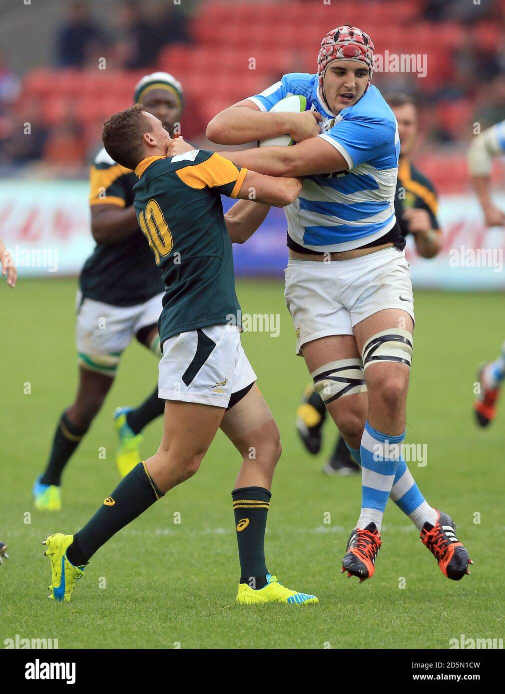 South Africa's Curwin Bosch (left) tackles Argentina's Franco Molina ...