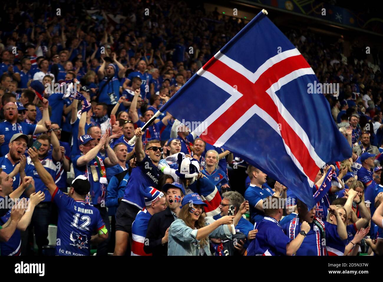 Iceland fans in the stands celebrate after the game Stock Photo - Alamy