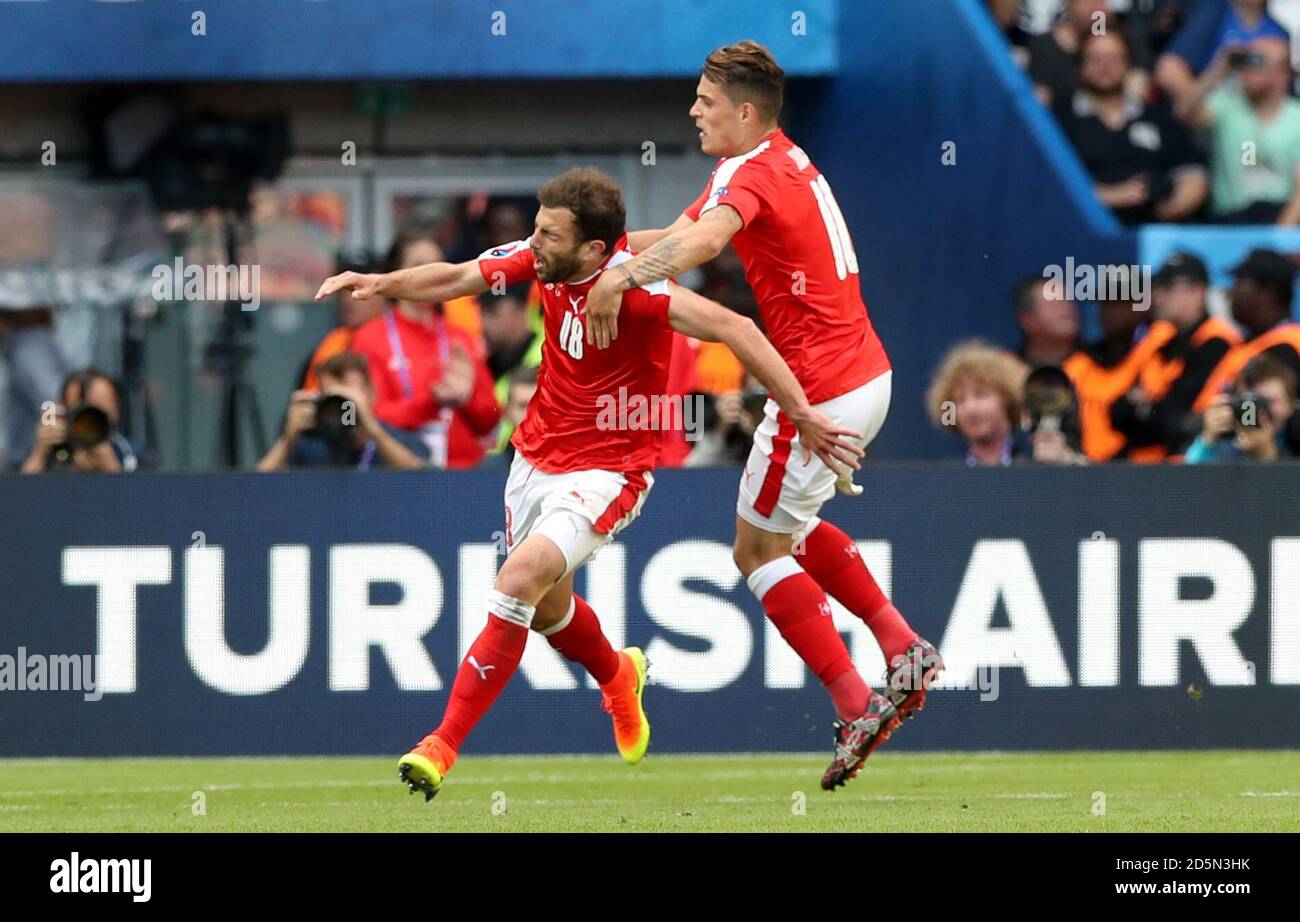 Switzerland's Admir Mehmedi (left) celebrates scoring his side's first ...
