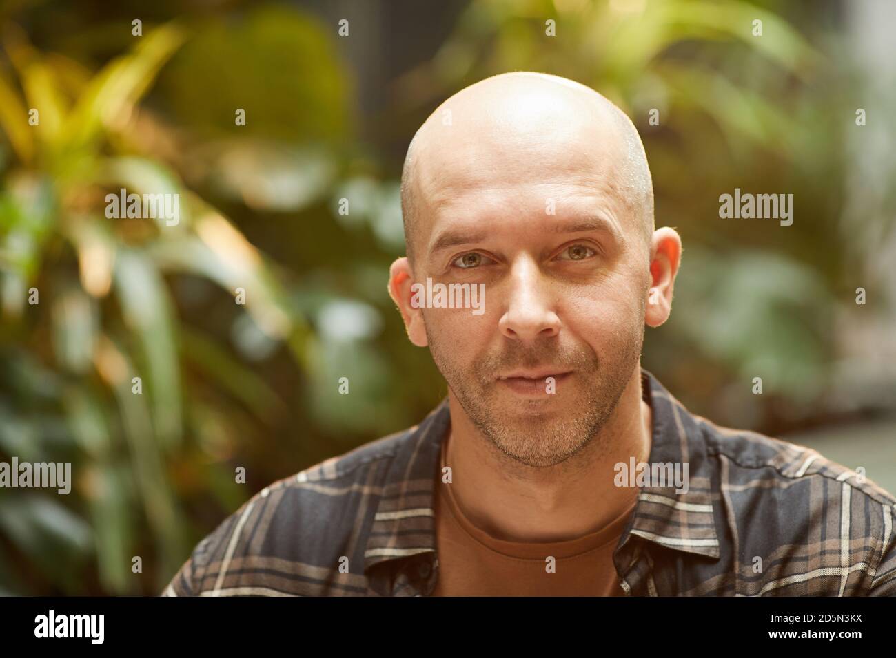 Portrait of mature balded man in shirt looking at camera Stock Photo ...