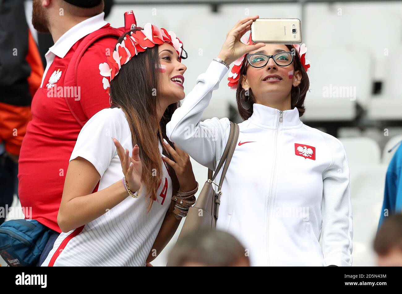 Poland fans show support for their team in the stands Stock Photo - Alamy