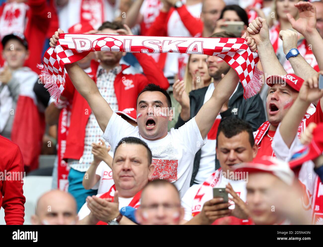 Poland fans show support for their team in the stands hi-res stock ...