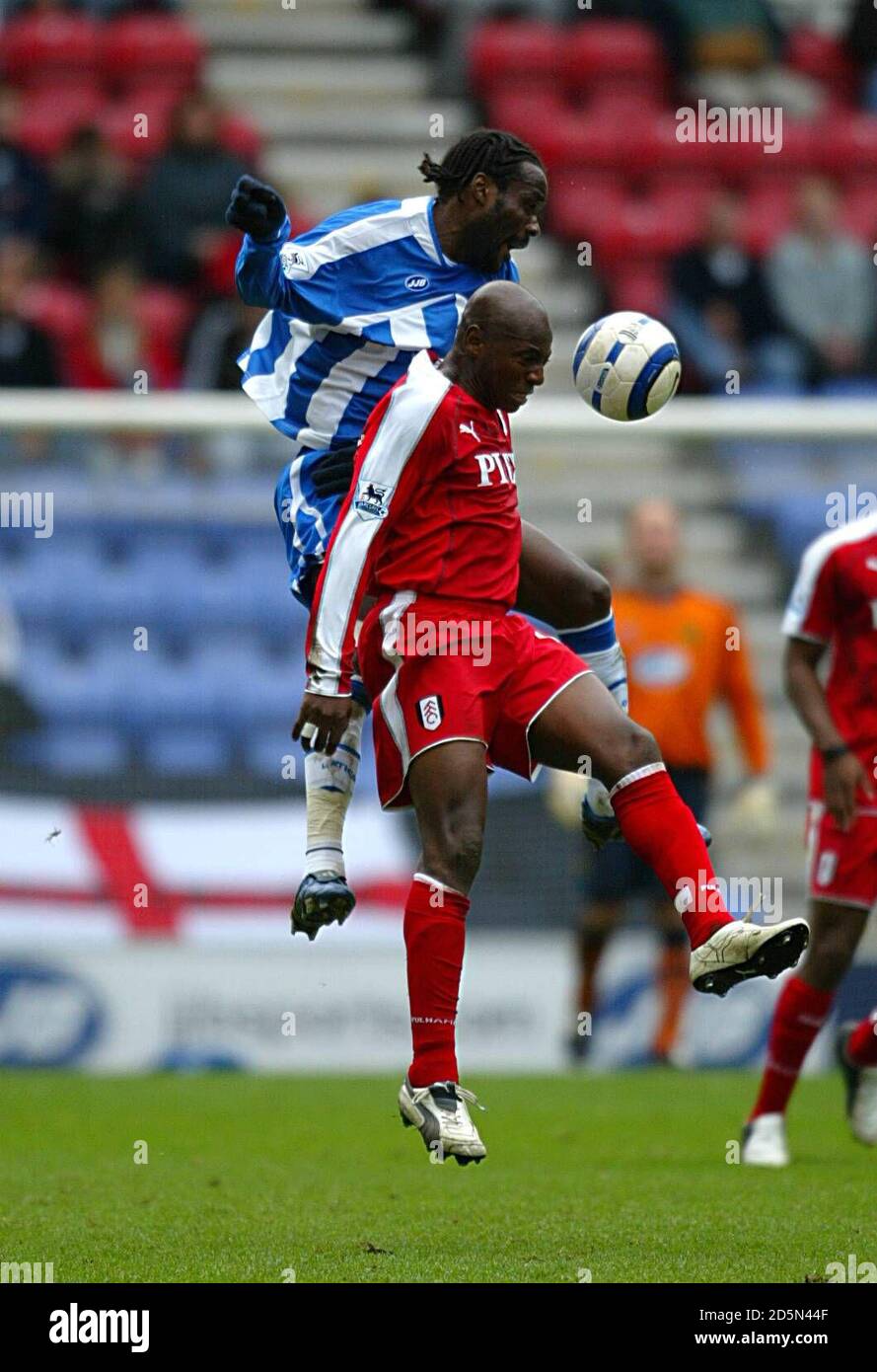 Wigan Athletic's Pascal Chimbonda (l) challenges Fulham's Luis Boa ...