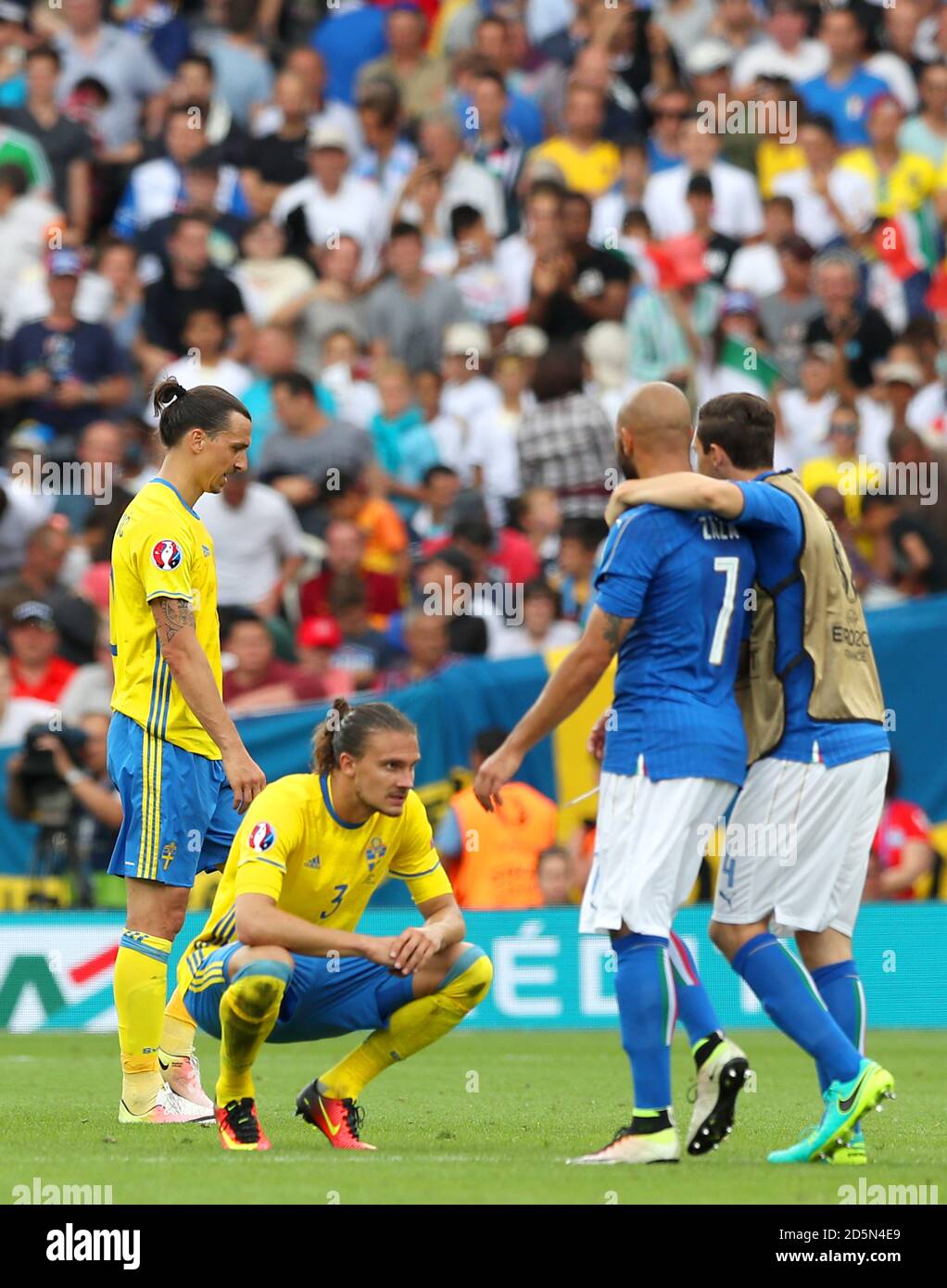 Italy players celebrate their win as Sweden's Zlatan Ibrahimovic leaves ...
