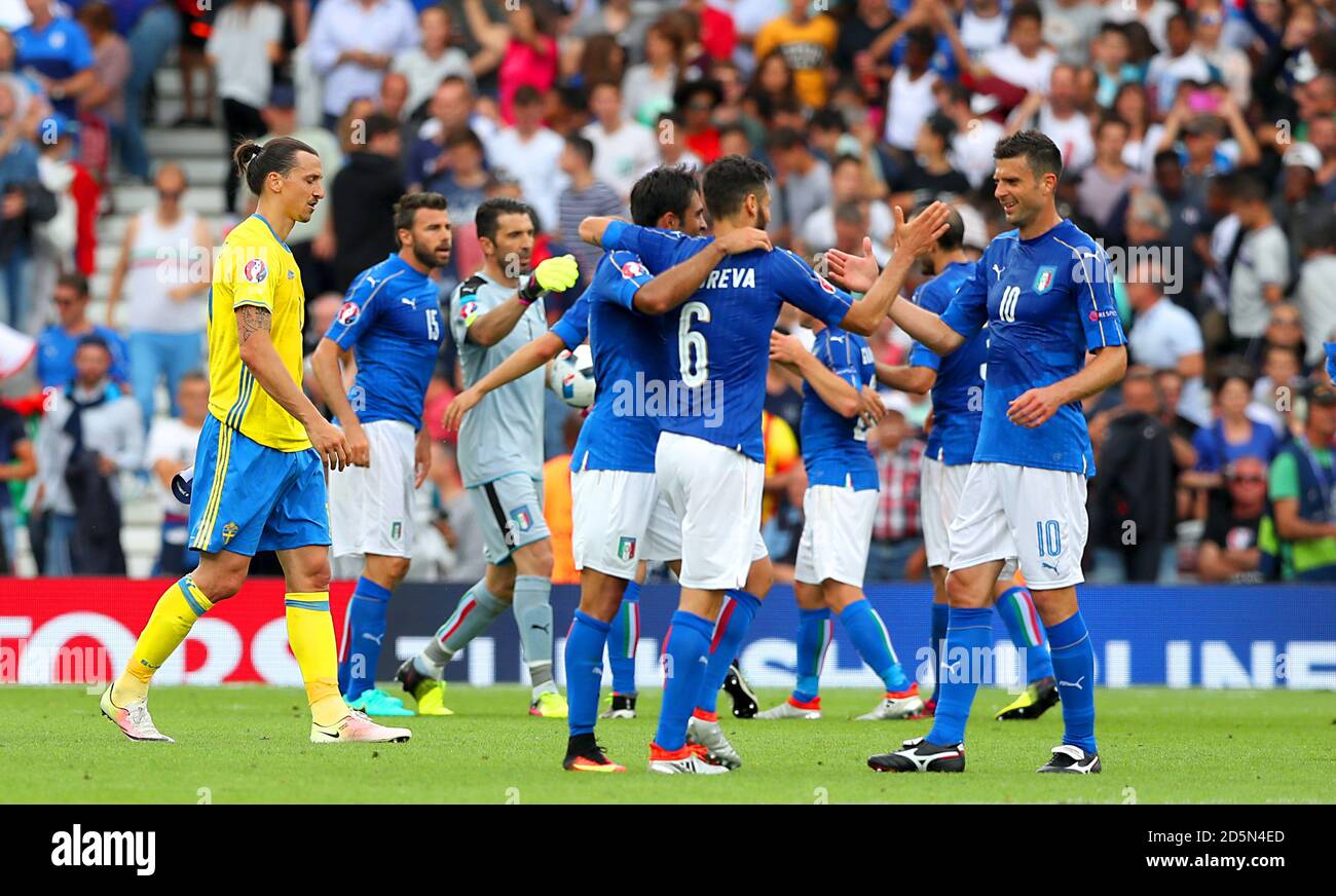Italy players celebrate their win as Sweden's Zlatan Ibrahimovic leaves ...