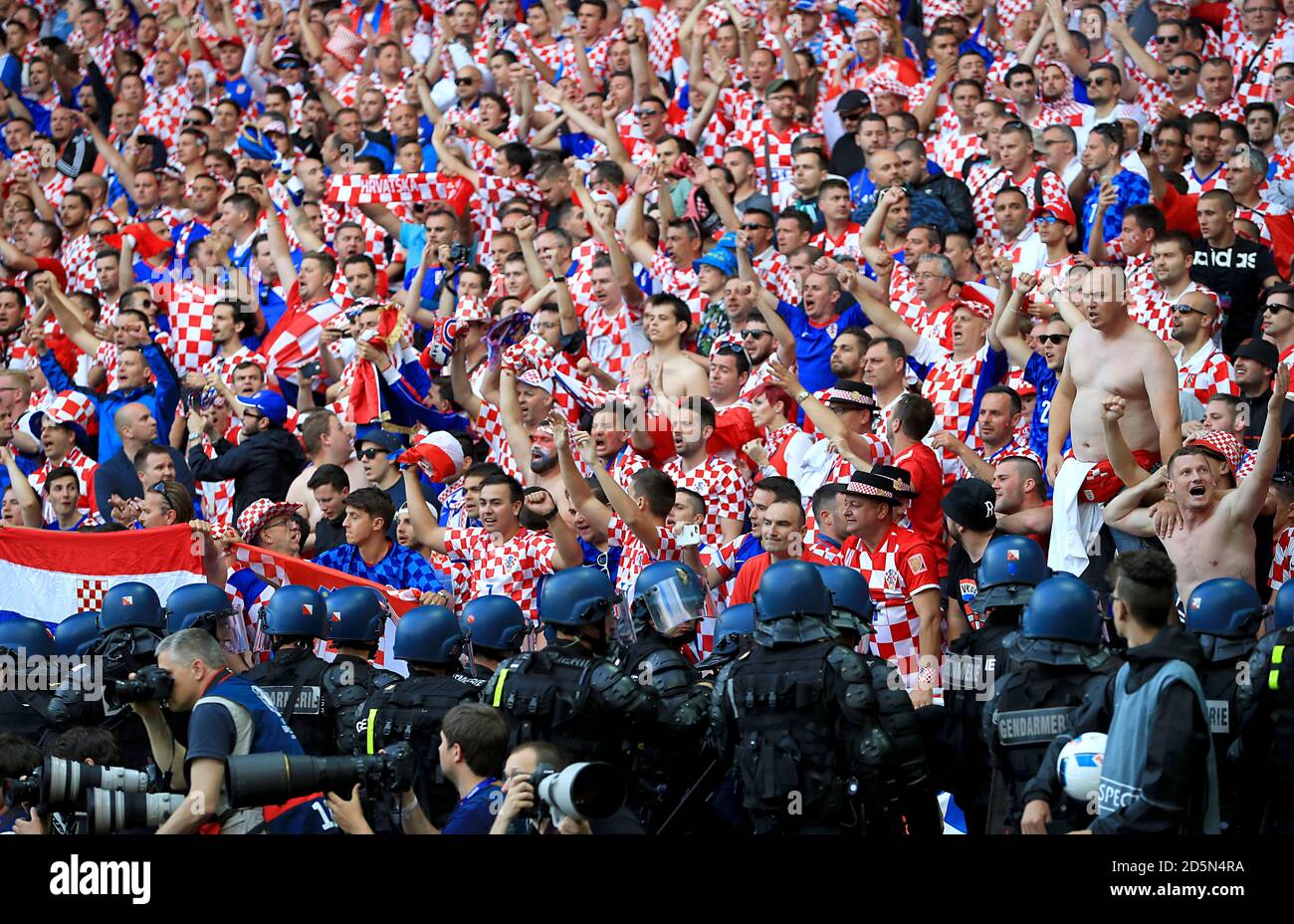 Croatia fans in the stands as police look on Stock Photo - Alamy