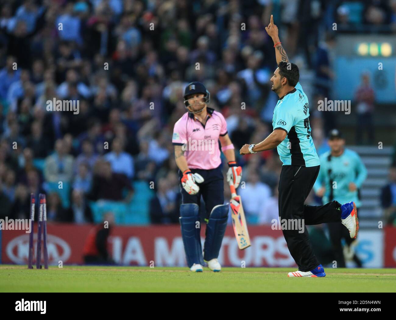 Surrey's Ravi Rampaul celebrates after taking the wicket of Middlesex's ...
