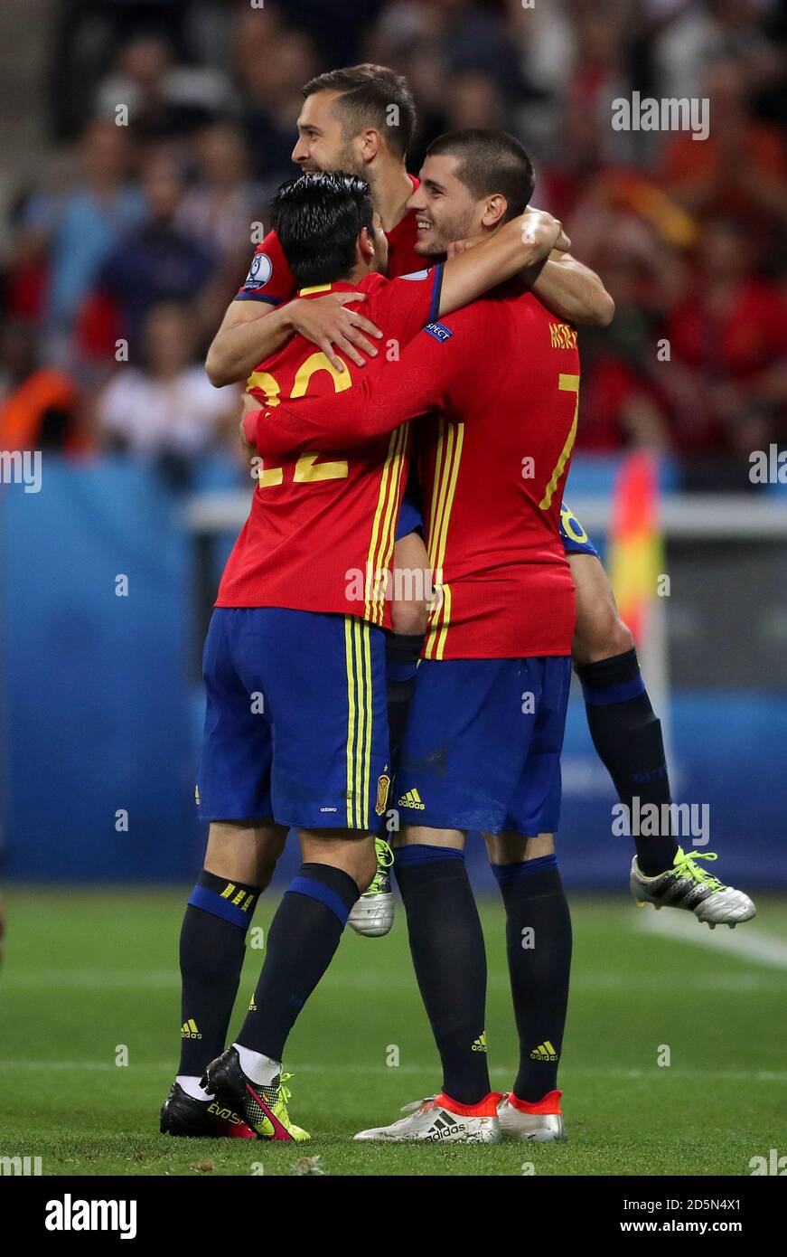 Spain's Alvaro Morata (right) celebrates with his team-mates after ...
