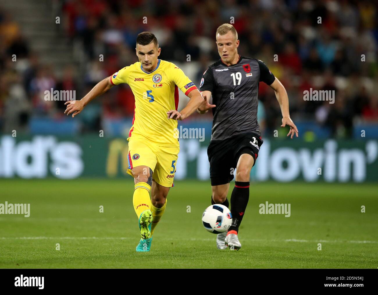 Romania's Ovidiu Hoban (left) and Albania's Bekim Balaj battle for the ...