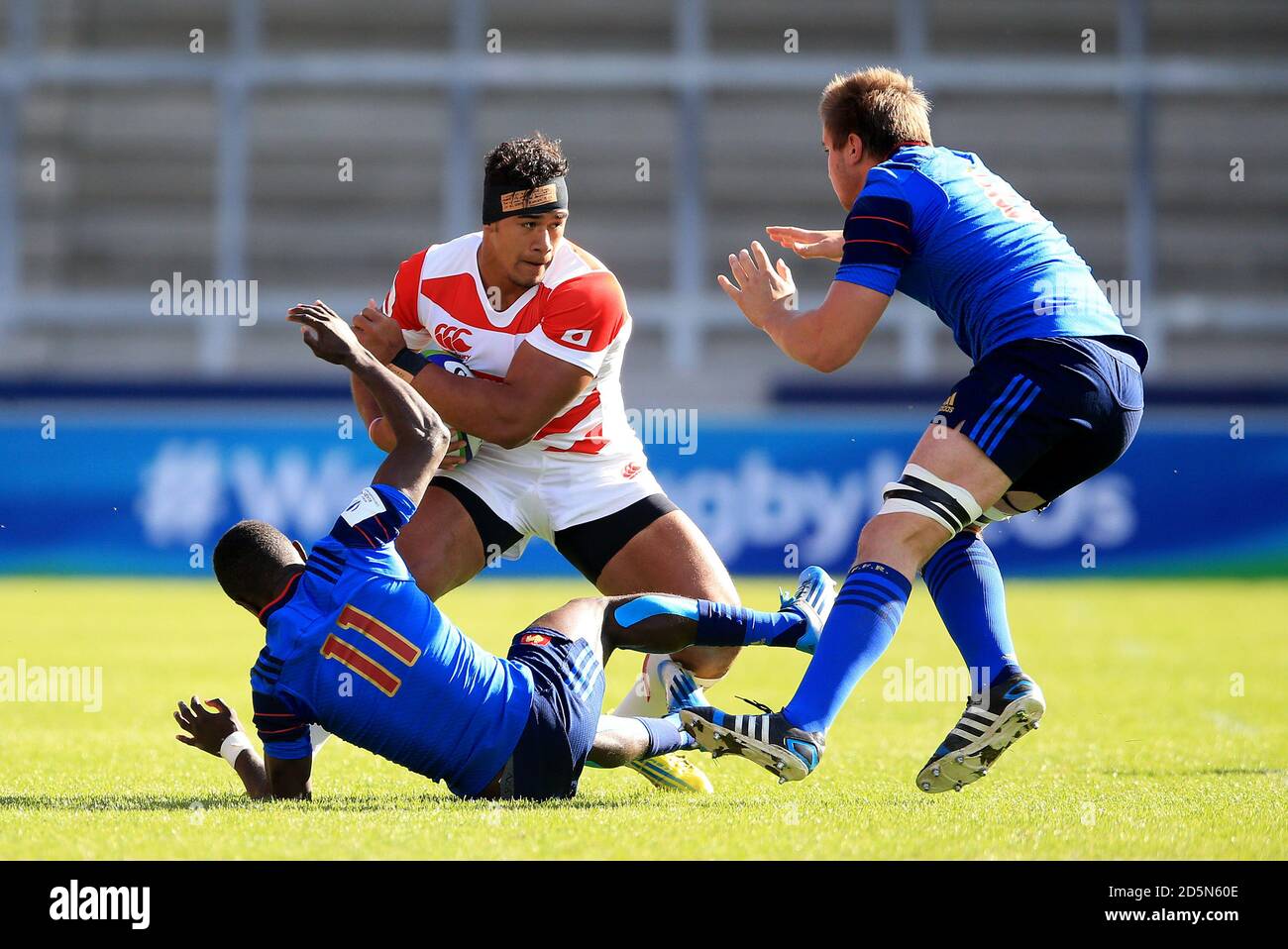 France's Gabriel Ngandebe (left) and Anthony Jelonch (right) tackle ...