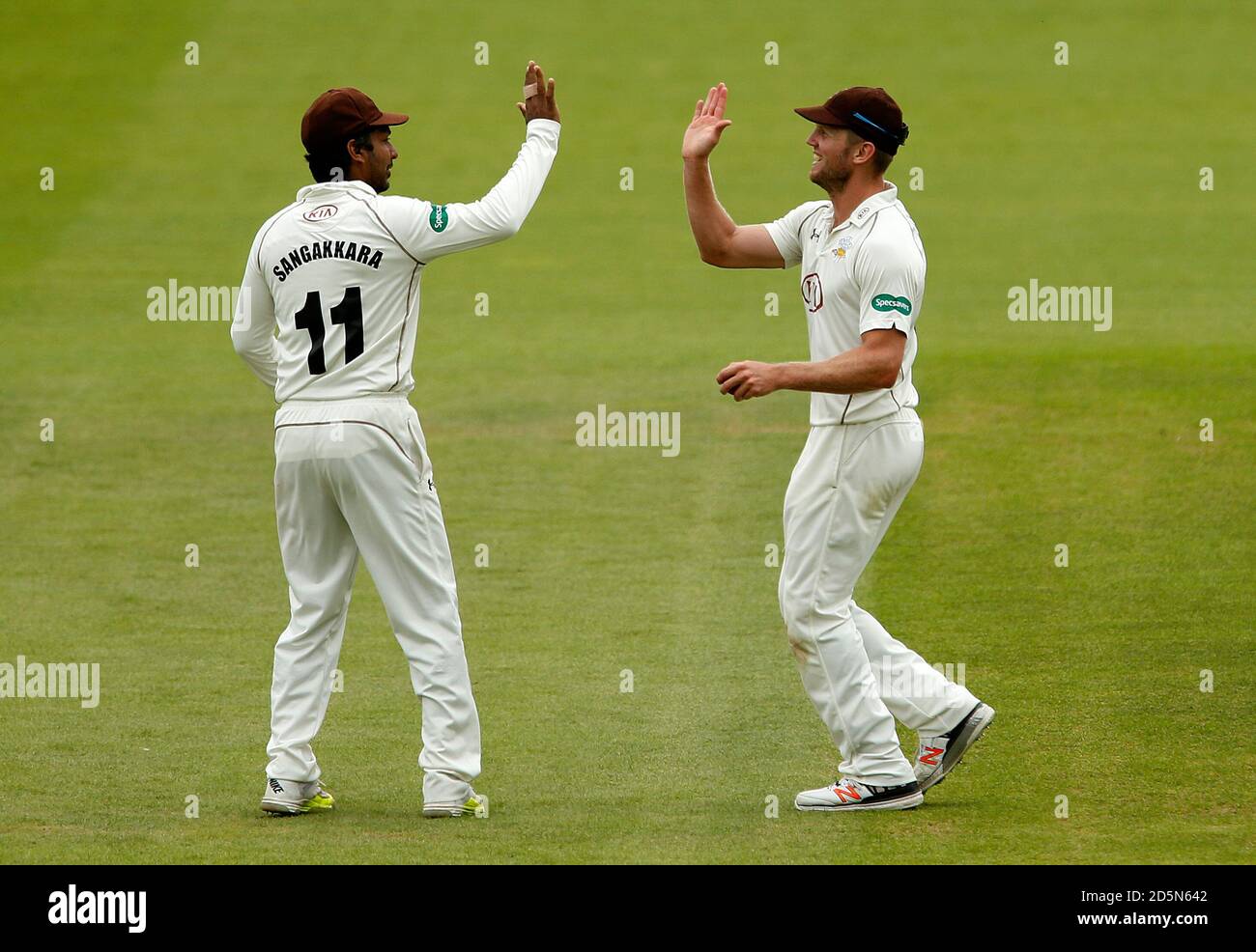 Surrey's Stuart Meaker celebrates with teammate Kumar Sangakkara after ...