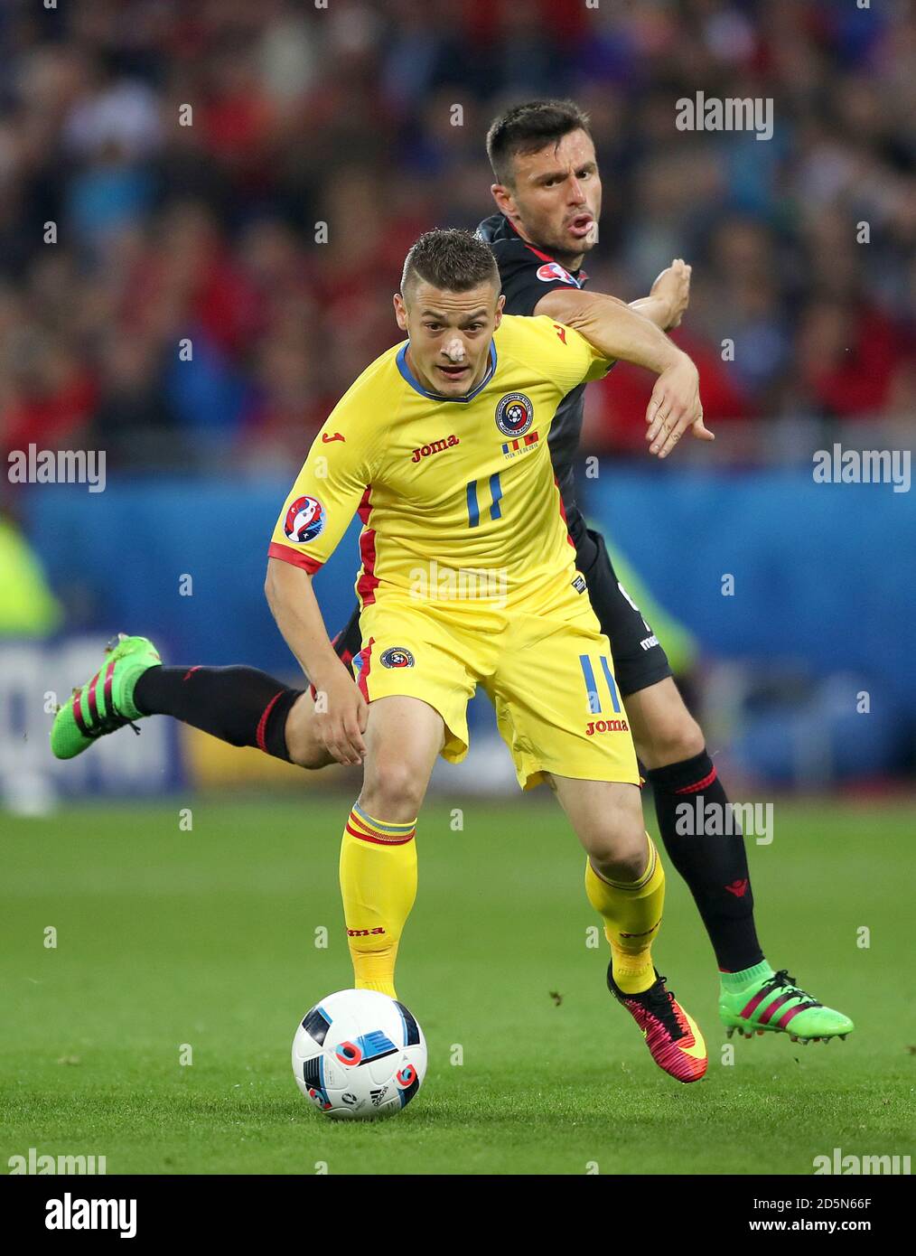 Romania's Gabriel Torje (left) and Albania's Ledian Memushaj battle for ...