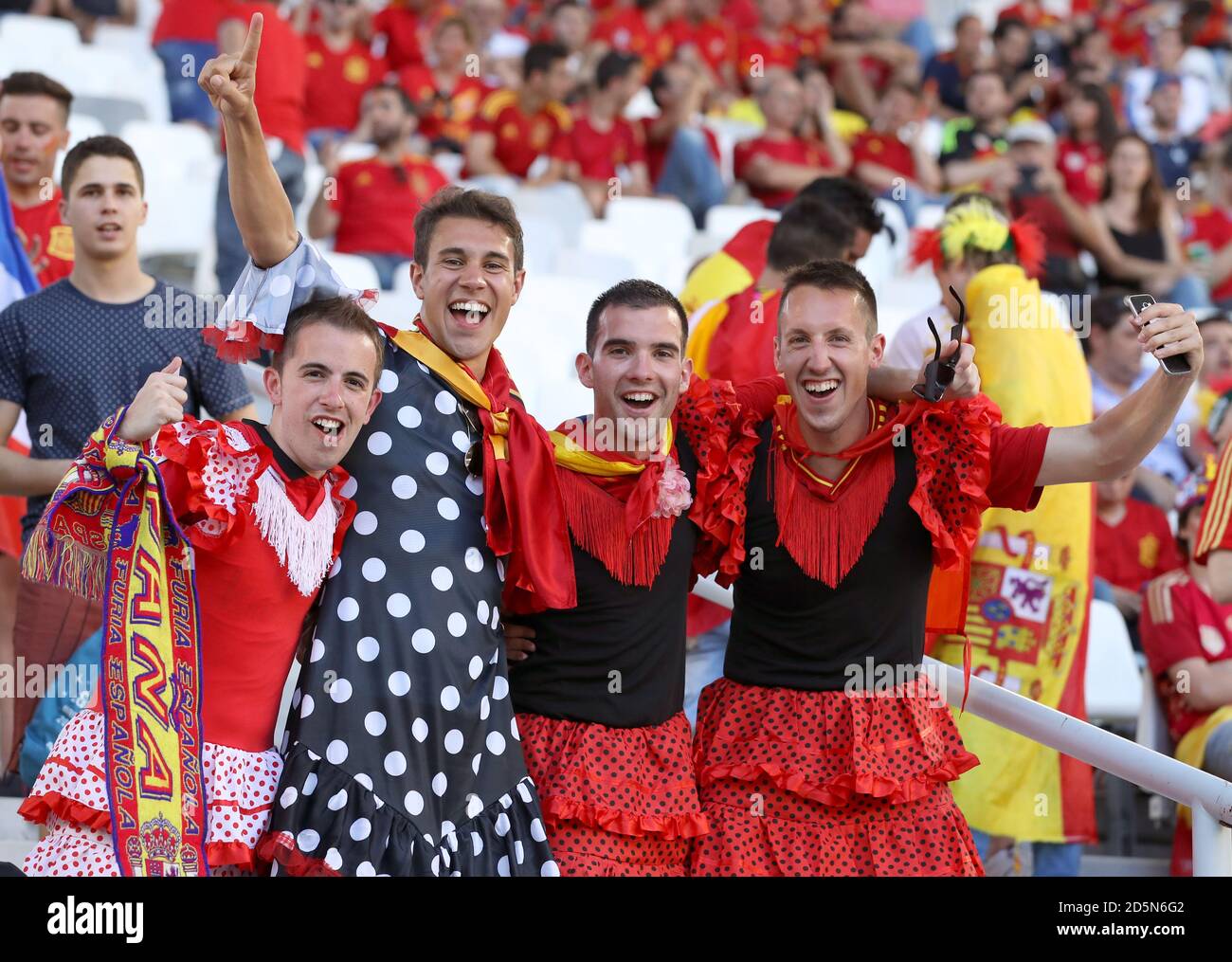 Spanish fans in fancy dress show their support Stock Photo - Alamy