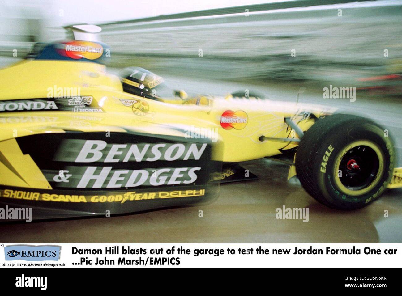 Damon Hill blasts out of the garage to test the new Jordan Formula One ...