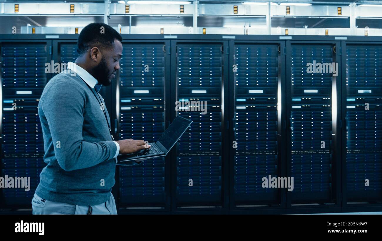 Professional man walking laptop computer hi-res stock photography and ...