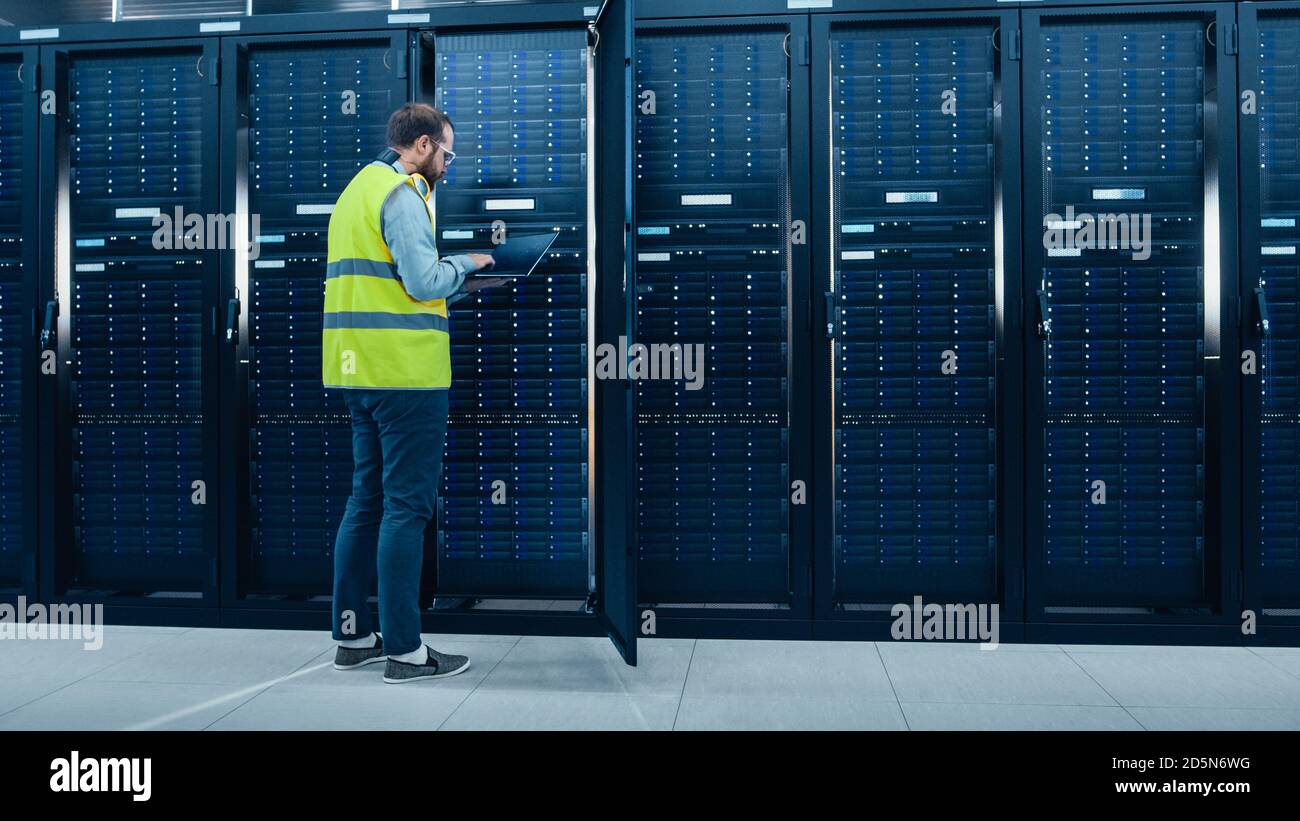 Science computing and information technology male standing hi-res stock ...