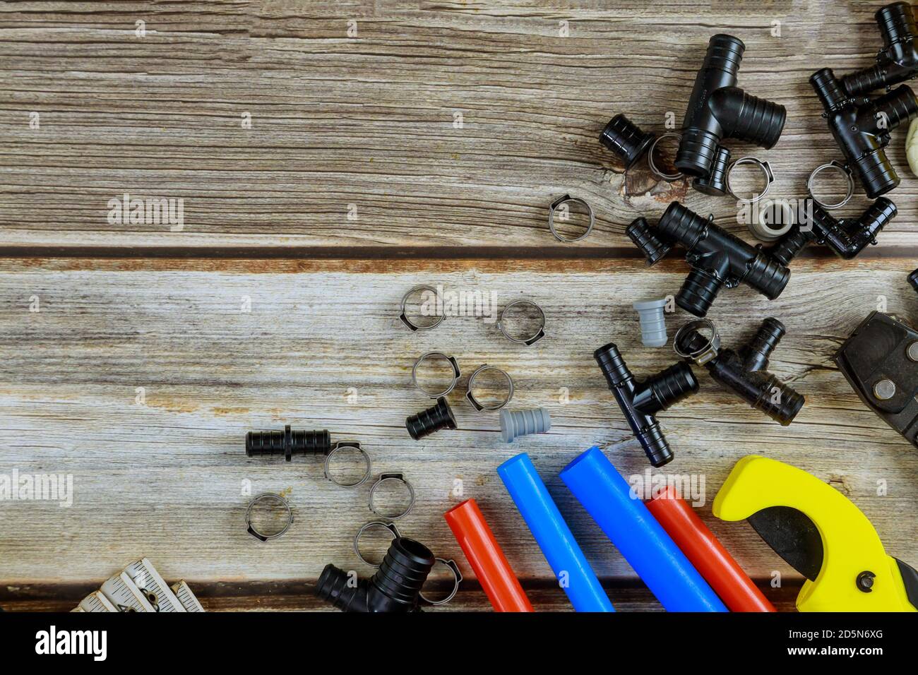 Various plumbers tools, pipe fittings on a home improvement plumbing ...