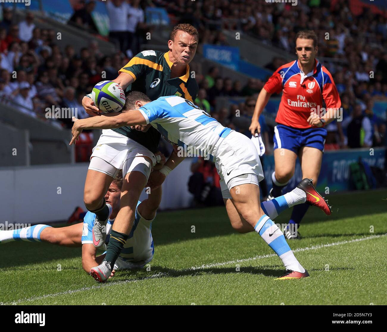 Argentina's Lautaro Bazan Velez (right) tackles South Africa's Curwin ...