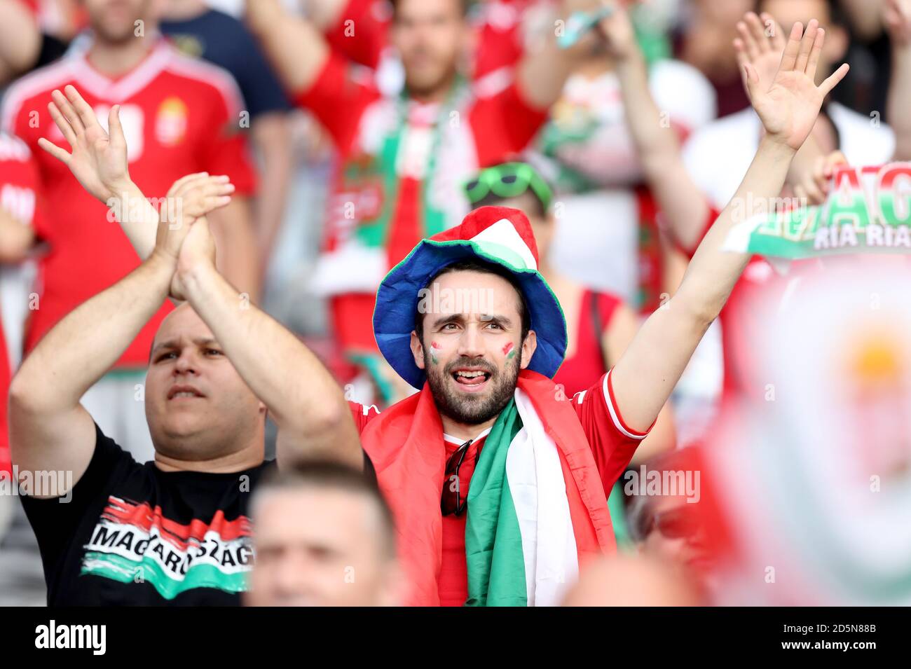 Hungary fans cheer on their side in the stands Stock Photo - Alamy
