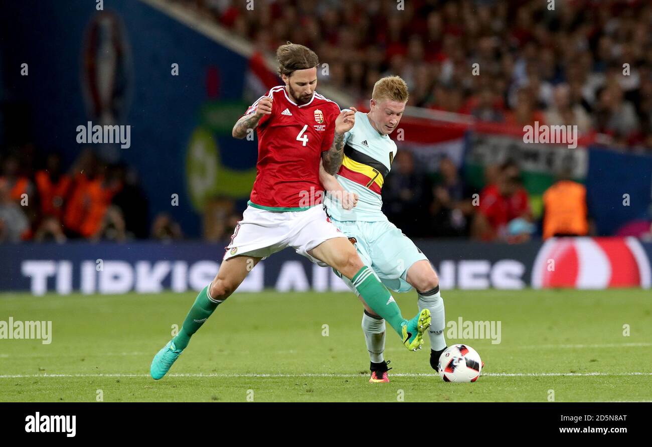 Belgium's Kevin De Bruyne (right) and Hungary's Tamas Kadar battle for ...