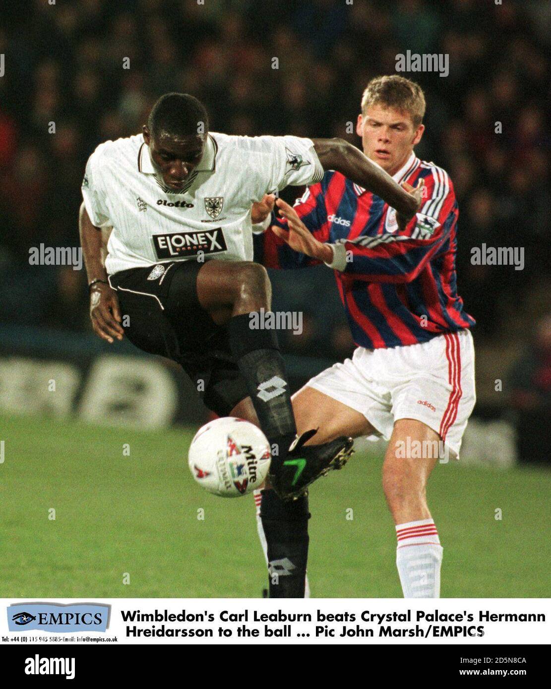 Wimbledon's Carl Leaburn (left) shields the ball from Crystal Palace's ...