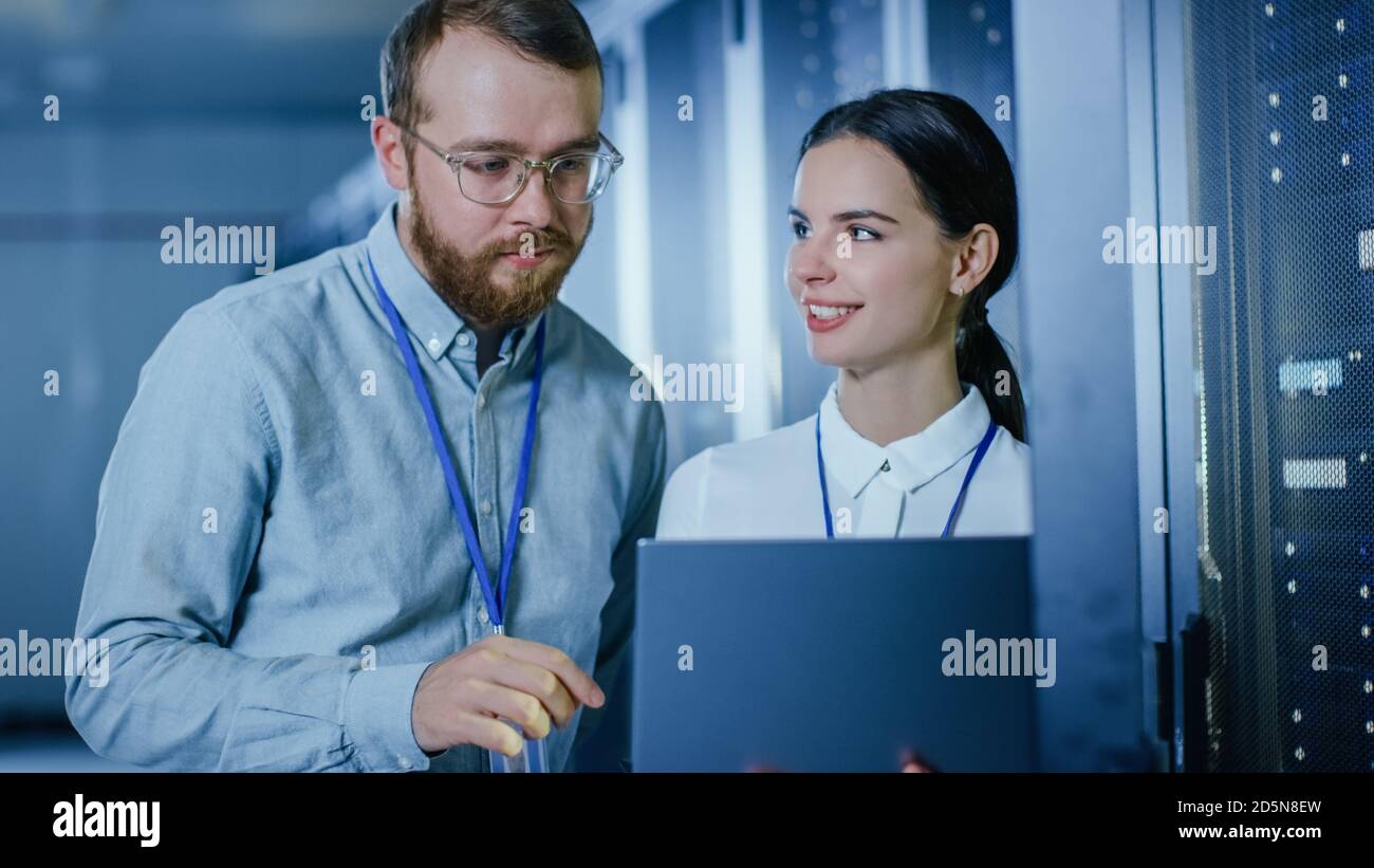 Bearded IT Technician in Glasses and Beautiful Young Engineer Colleague ...