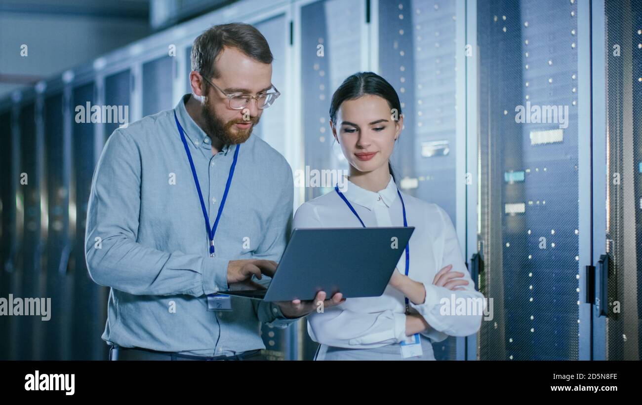 Bearded IT Technician in Glasses and Beautiful Young Engineer Colleague ...