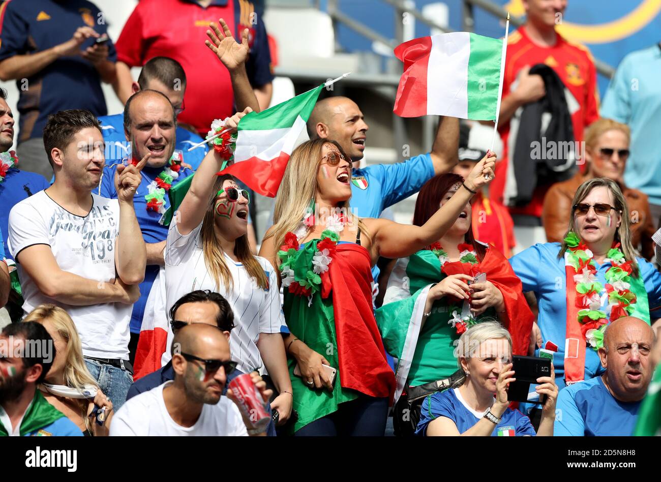 Italy fans cheer on their side in the stands Stock Photo - Alamy