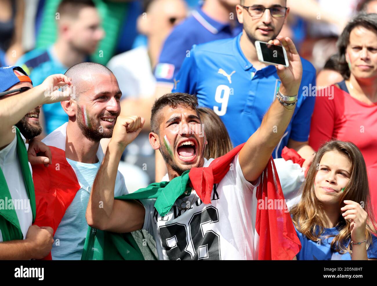 Italy fans take a selfie in the stands before kick off Stock Photo - Alamy