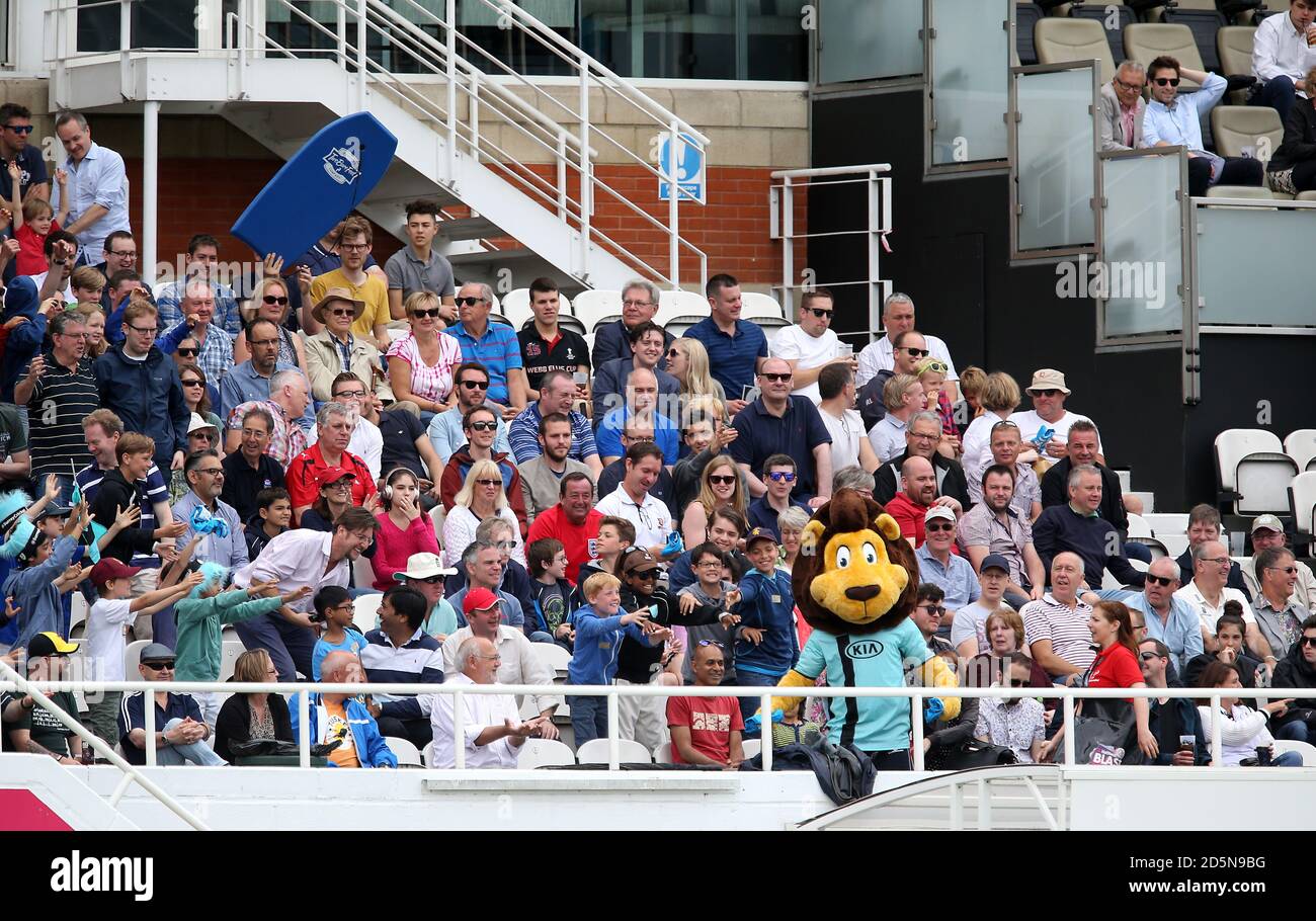 Surrey mascot Caesar the Lion throws t-shirts into the stands for the ...