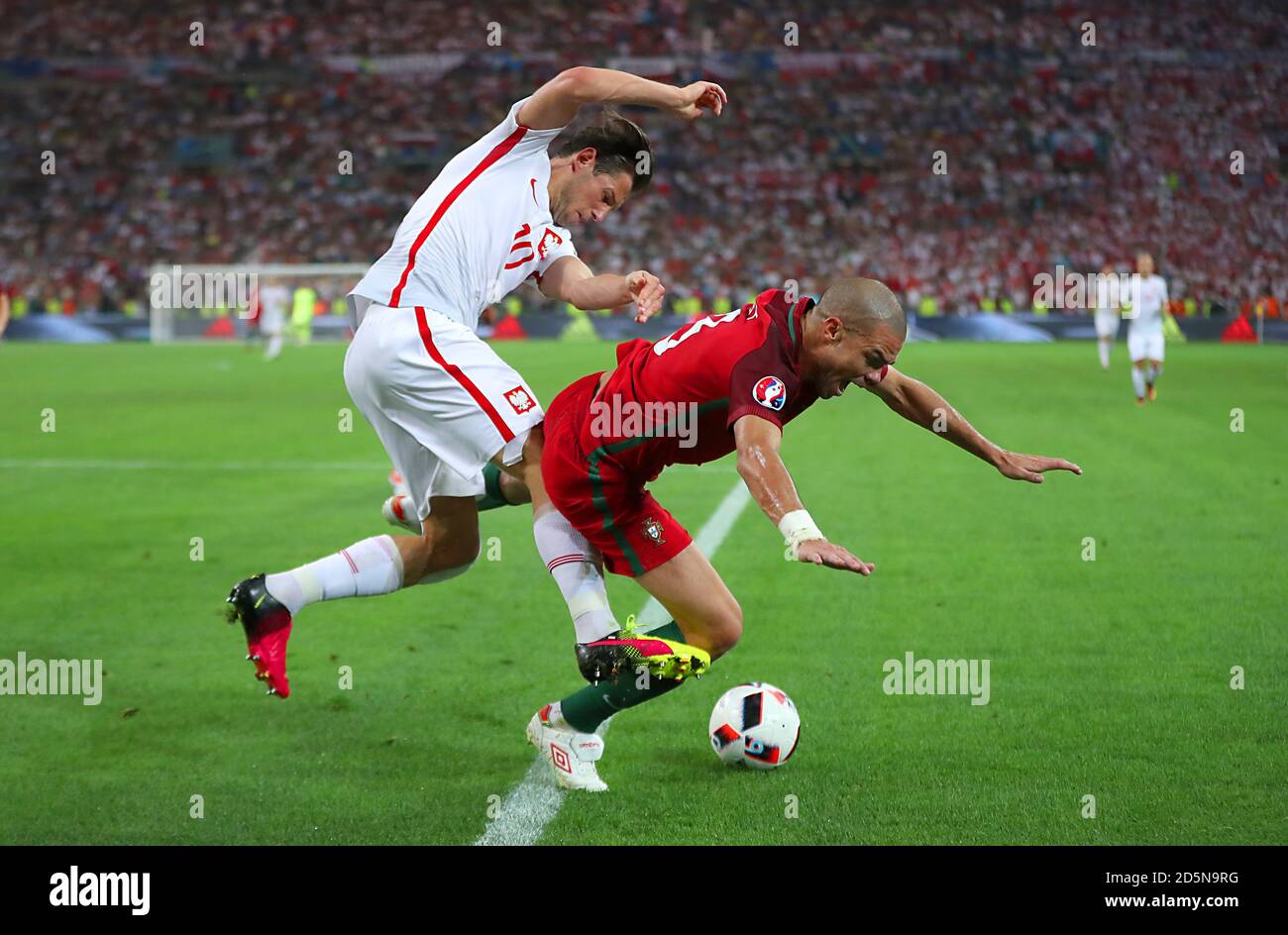 Poland's Grzegorz Krychowiak (left) and Portugal's Pepe battle for the ...