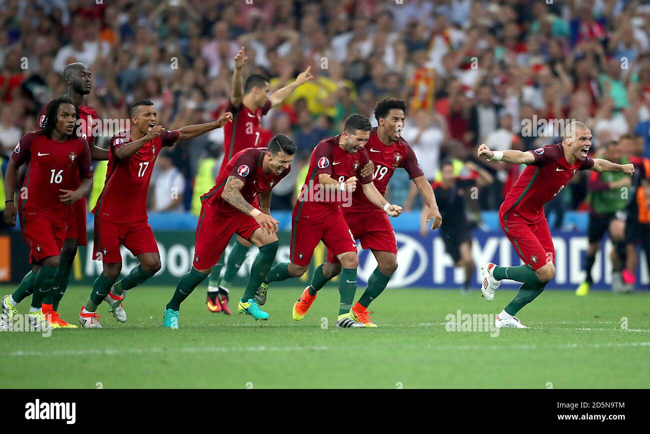 Portugal players celebrate winning the penalty shootout and the match ...