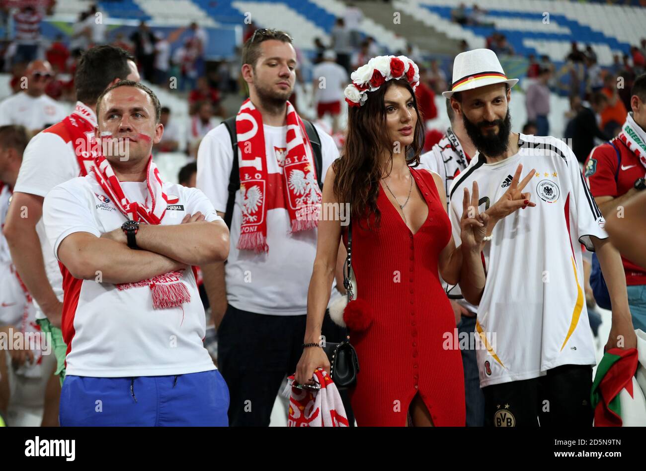 Poland fans look dejected in the stands Stock Photo - Alamy