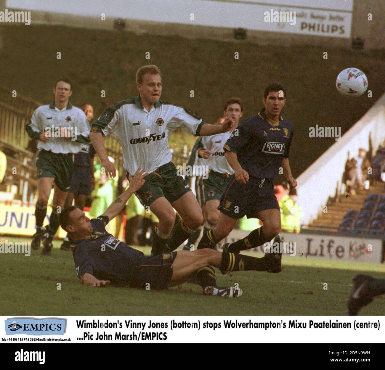 Wimbledon's Vinny Jones (on floor) tackles Wolverhampton Wanderers ...
