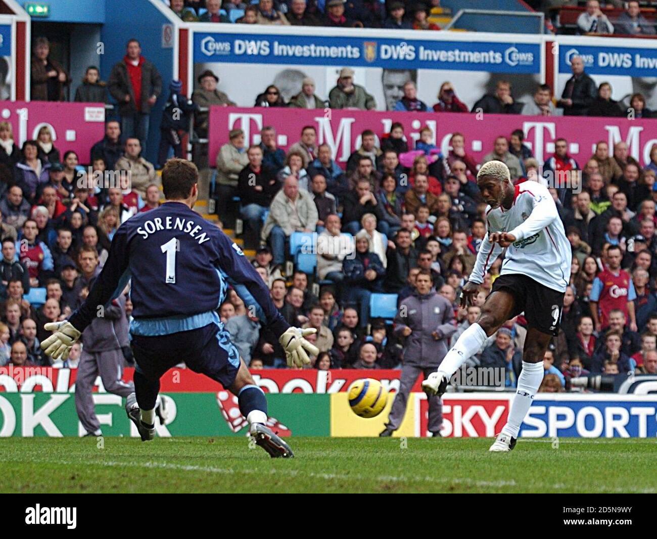 Liverpool's Djibril Cisse has his shot saved by Aston Villa goalkeeper Thomas Sorensen Stock ...