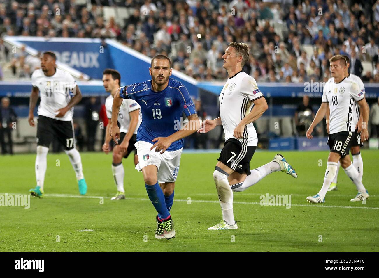 Italy's Leonardo Bonucci (centre left) celebrates scoring their first ...
