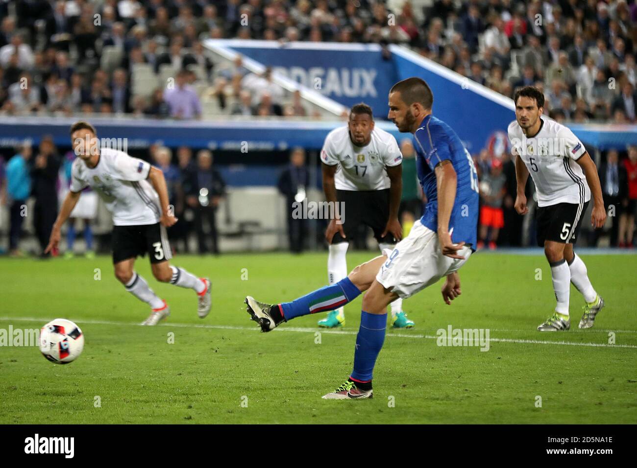 Italy's Leonardo Bonucci scores their first goal from the penalty spot ...
