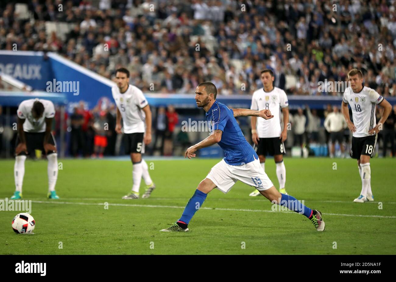 Italy's Leonardo Bonucci scores their first goal from the penalty spot ...