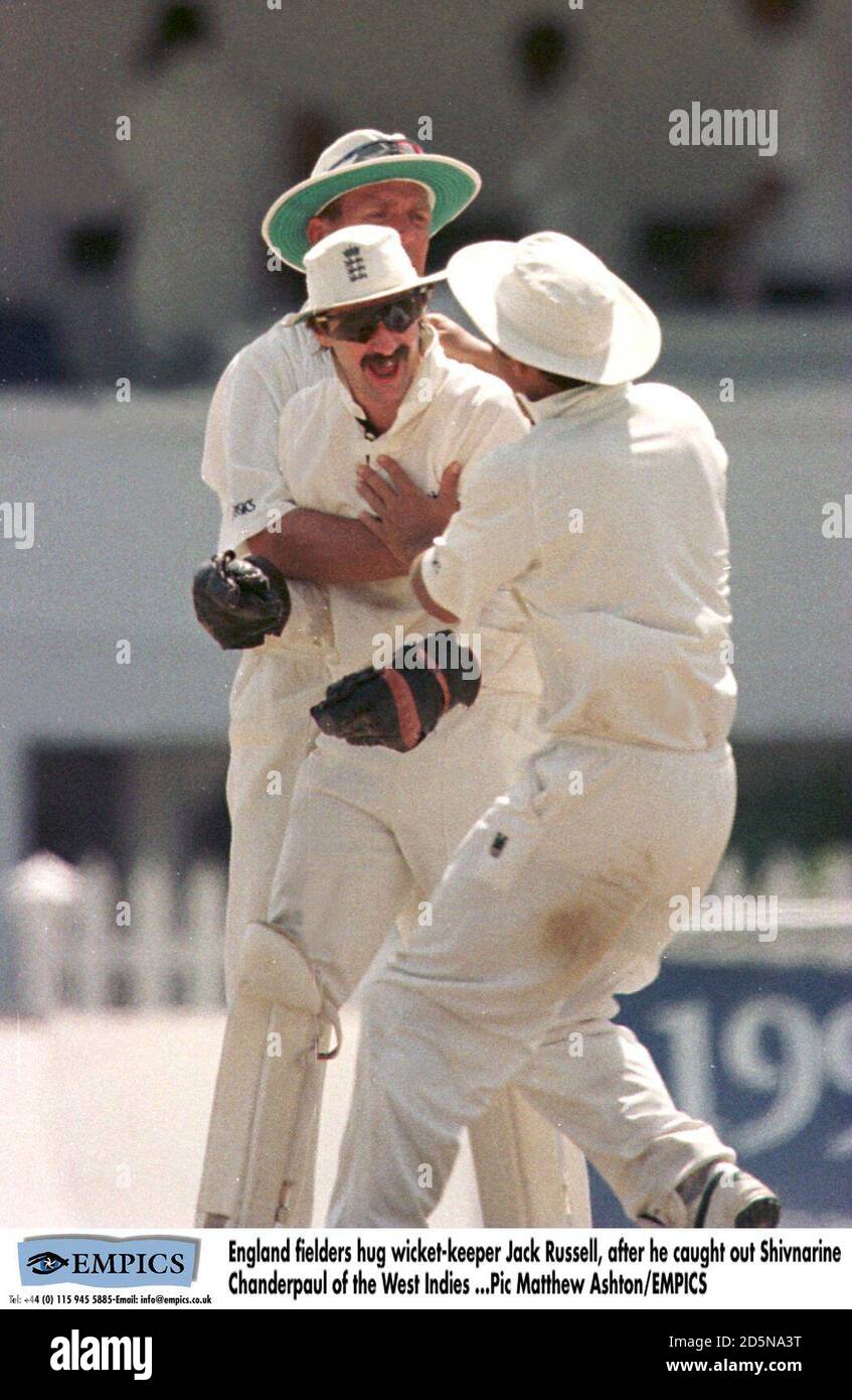 England fielders hug wicket-keeper Jack Russell (centre), after he ...