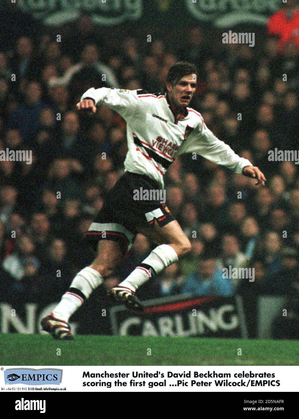 Manchester United's David Beckham celebrates scoring the first goal ...