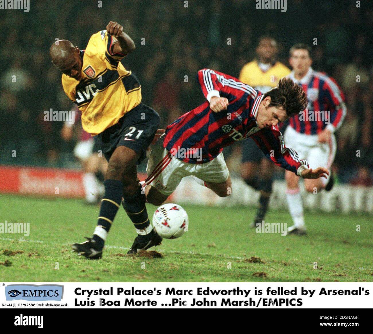 Crystal Palace's Marc Edworthy is felled by Arsenal's Luis Boa Morte ...