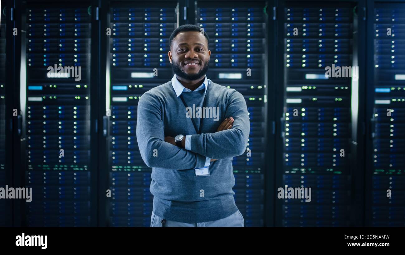 Bearded Black IT Engineer Standing and Posing with Crossed Arms in the ...