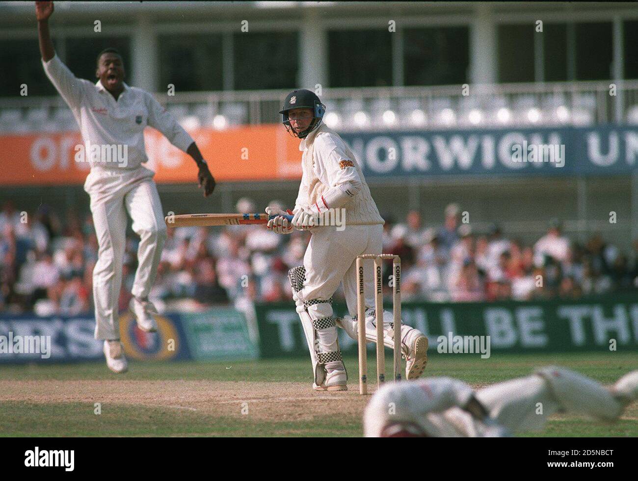 England's Michael Atherton (centre) is caught by West Indies ...