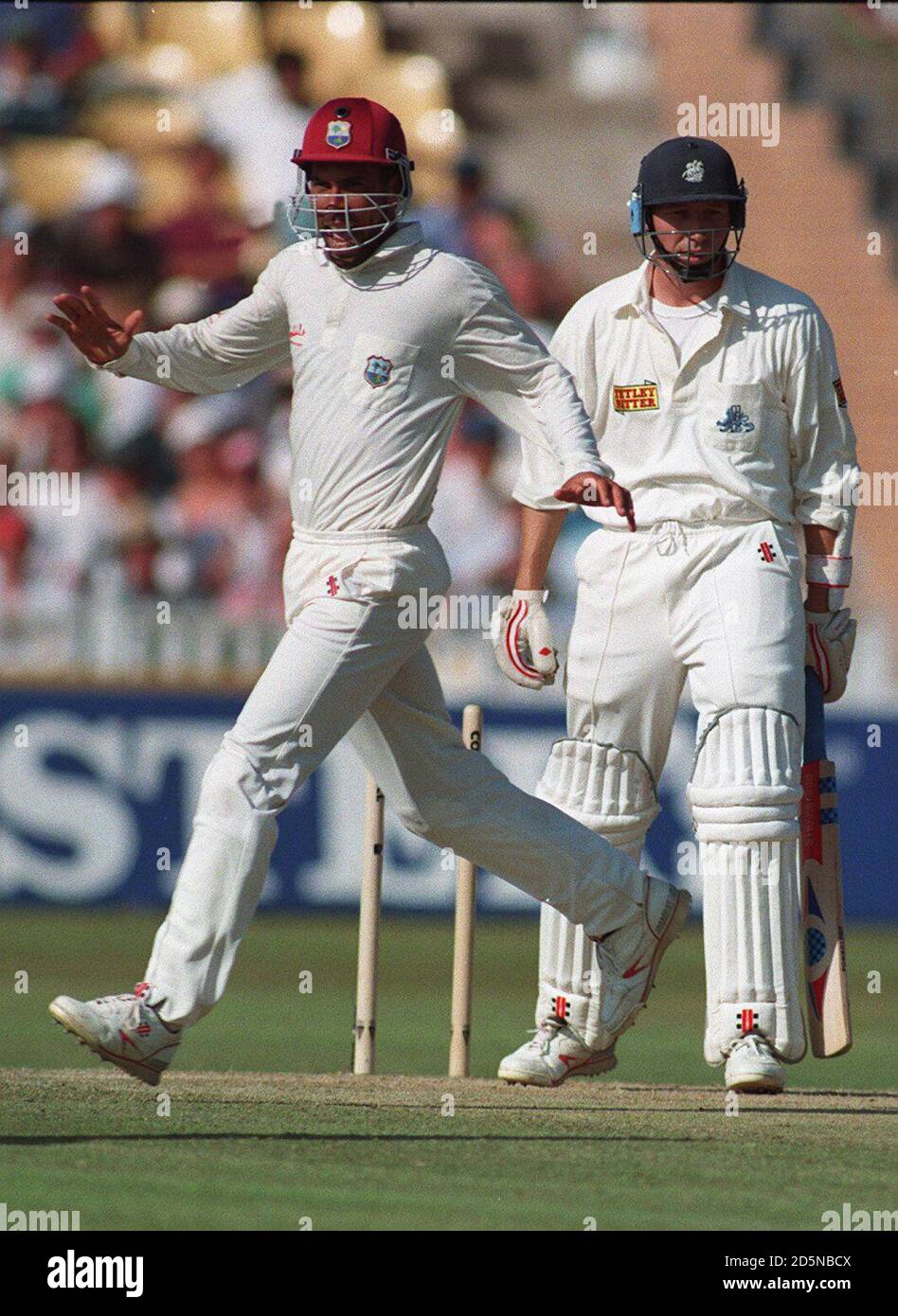 West Indies' Jimmy Adams (left) rushes to congratulate teammate Ian ...