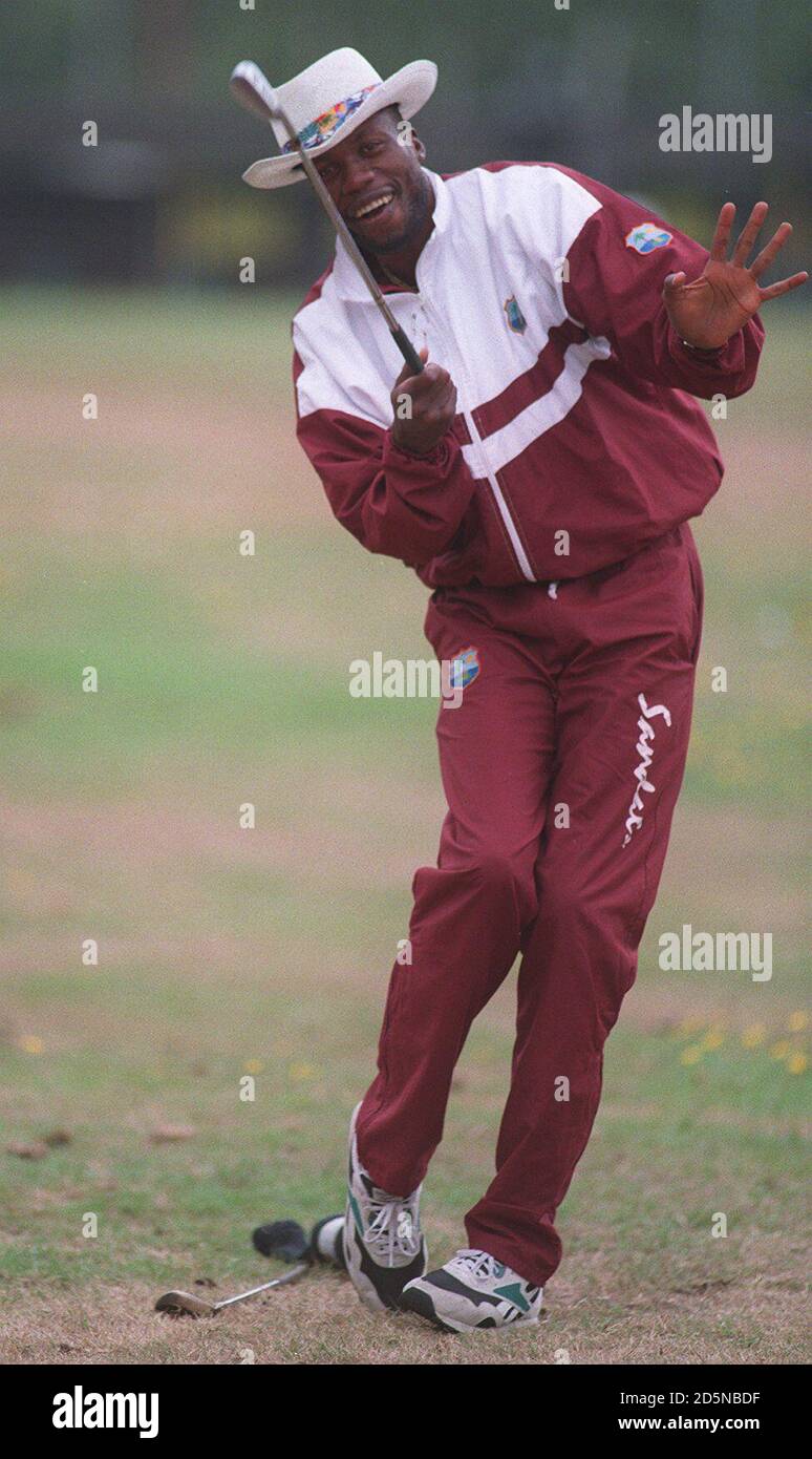 West Indies cricketer Curtly Ambrose shows his style on the golf course ...