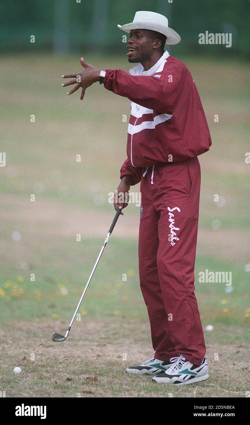 West Indies cricketer Curtly Ambrose shows his style on the golf course ...